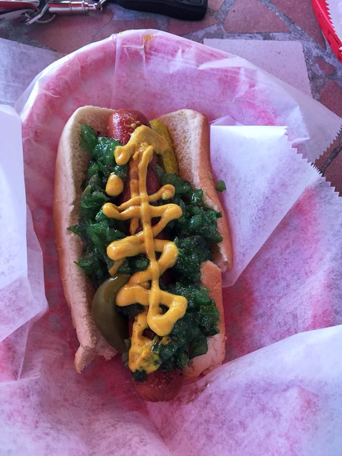 The Chicago Dog—a symphony of toppings that somehow creates harmony rather than chaos. That neon-green relish is practically winking at you.