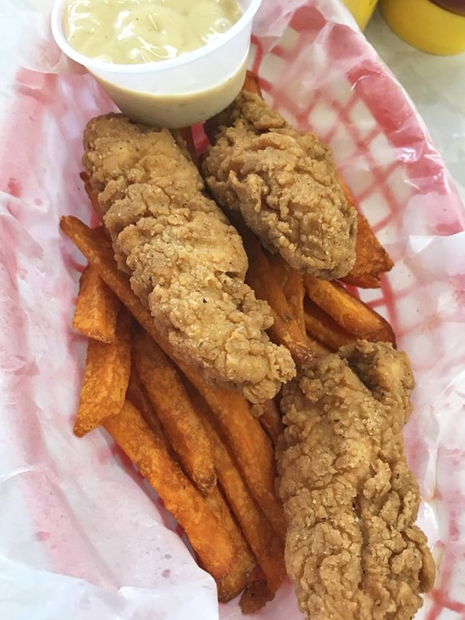 Golden-brown perfection that Colonel Sanders would envy. These chicken tenders achieve that mythical balance of crispy exterior and juicy interior, with sweet potato fries as their perfect partner.