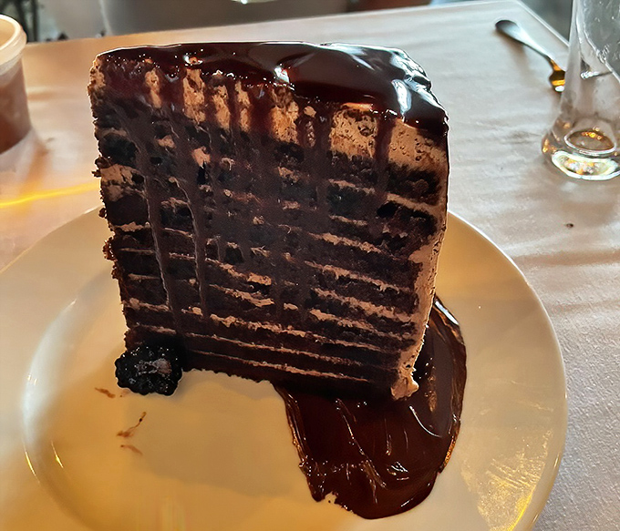 Ten layers of chocolate commitment that makes marriage look casual by comparison. This cake doesn't just satisfy cravings—it creates disciples.