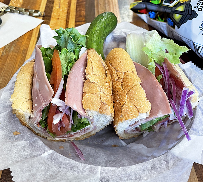 The club sandwich—where turkey and veggies have a meeting of minds between bread. That pickle is the exclamation point on a delicious sentence.