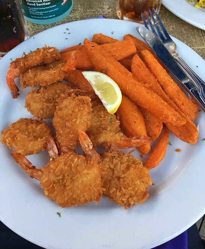 Golden-fried coconut shrimp that could make a seafood skeptic change religions. Those sweet potato fries aren't just sides—they're worthy companions to the main event.