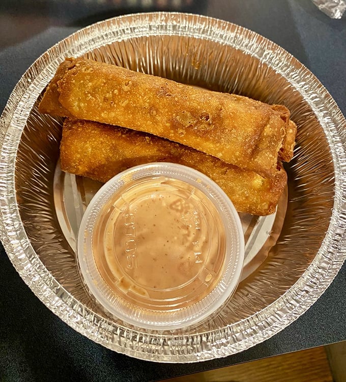 Golden-fried egg rolls that shatter the rulebook. Crispy exterior giving way to a savory filling, with that dipping sauce taking things to an entirely different dimension.
