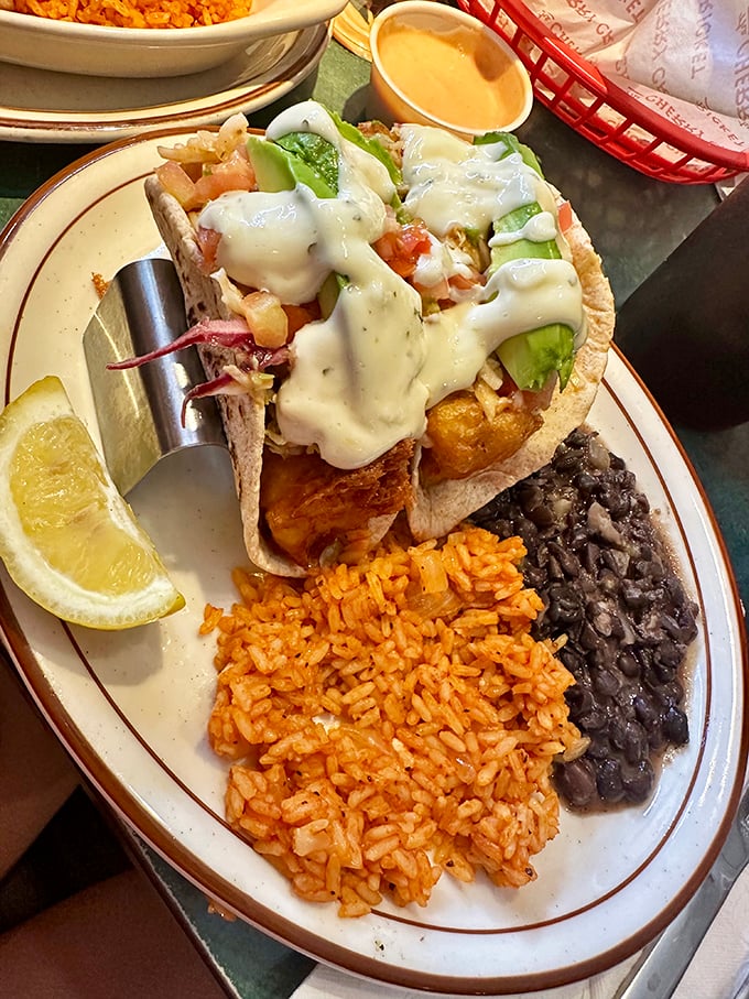 Fish tacos that bring coastal vacation vibes to landlocked Colorado, complete with Spanish rice and black beans that refuse to be mere sidekicks.