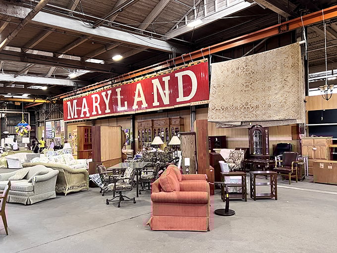 That "MARYLAND" sign isn't just state pride—it's a salvaged piece of history hovering above an eclectic furniture collection waiting for new homes.