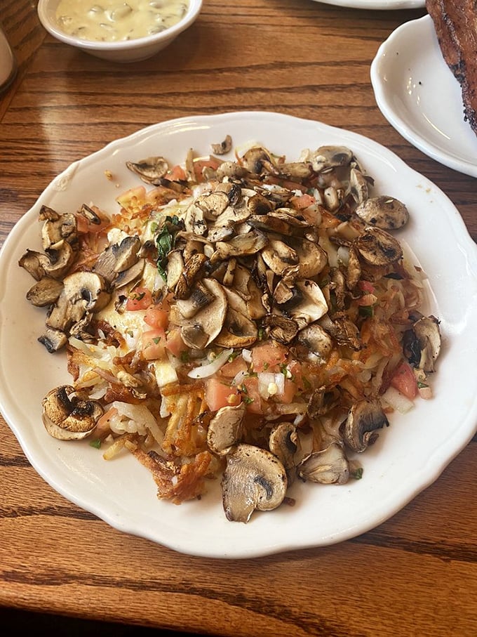 This isn't just a hash brown—it's a mushroom-topped masterpiece that makes you question why potatoes ever agreed to be prepared any other way.