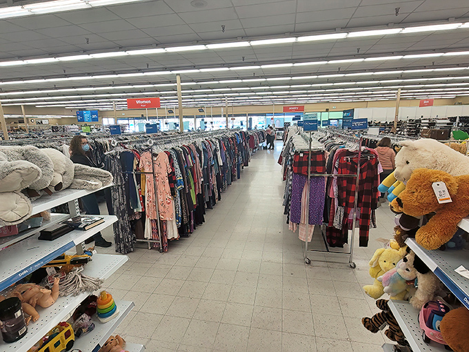 A textile rainbow stretches before you—each hanger a potential "where did you get that?" conversation starter waiting to happen.