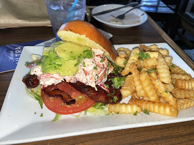 This isn't just a sandwich; it's seafood architecture—layers of fresh lobster salad, bacon, and avocado that make ordinary lunch breaks seem like tragic missed opportunities.