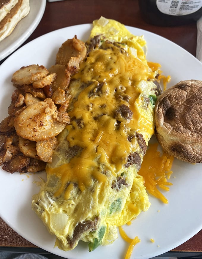 An omelet that doesn't just contain cheese—it embraces it in a warm, gooey bear hug that says "good morning" in the most delicious way.