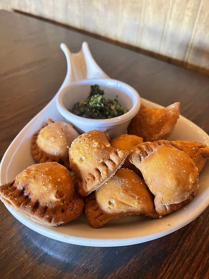 Pastelitos: little pockets of heaven that make you wonder why you ever wasted time on boring appetizers. The green sauce adds that perfect zing.