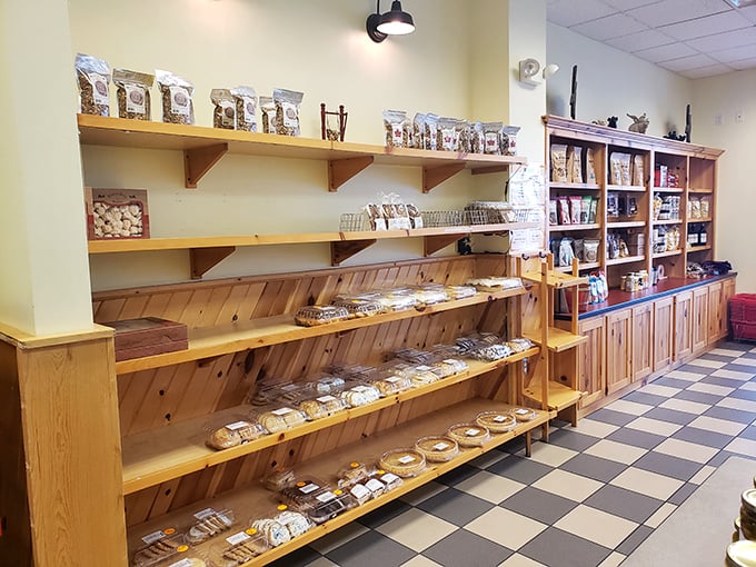 The wooden shelves hold treasures more valuable than gold—fresh-baked goods that make you question every supermarket "bakery" you've ever visited.