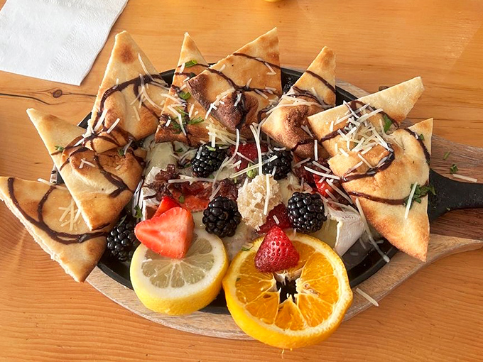 Not just any appetizer—these triangles of joy surround fresh berries and citrus with the enthusiasm of a welcoming committee.