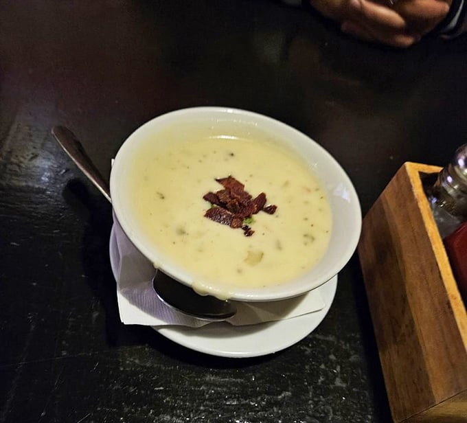 Creamy potato soup topped with crispy bacon bits—comfort in a bowl. Like a warm hug on a rainy London day, transported to Tennessee.