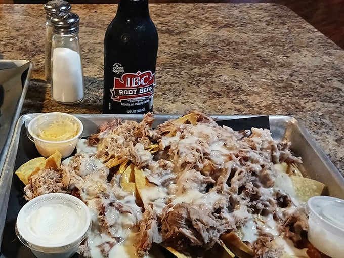 Pulled pork nachos that make you wonder why you've wasted years eating plain tortilla chips when this masterpiece could exist.