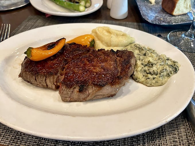 A ribeye that's achieved that magical balance—charred exterior giving way to a juicy interior that makes conversation impossible.