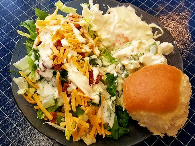 This isn't some wimpy side salad—it's a full-throated vegetable celebration with enough cheese to make Wisconsin proud.