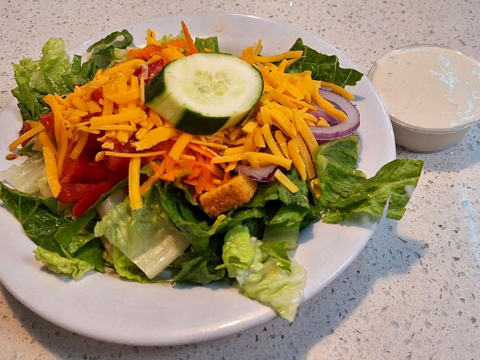 A garden on a plate that somehow doesn't feel like punishment. This fresh salad proves healthy options exist even in the temple of comfort food.