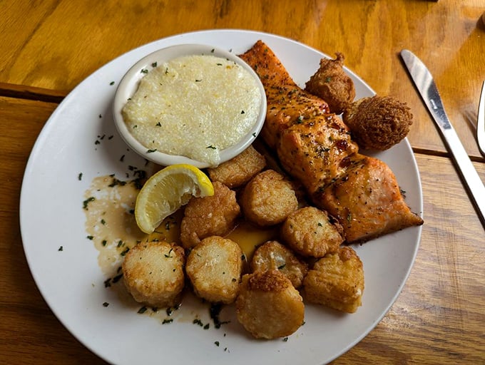 A seafood trifecta that hits all the right notes—tender salmon, perfectly seared scallops, and creamy grits that would make any Southerner proud.
