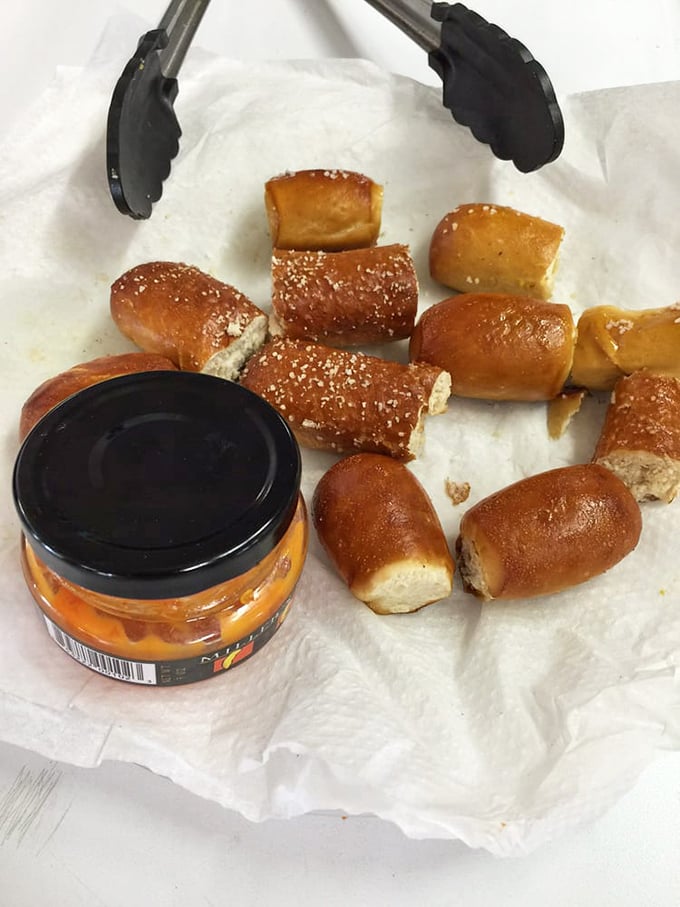 Bite-sized pretzel nuggets waiting for their mustard bath—proof that sometimes the best things in life come in small, perfectly browned packages.