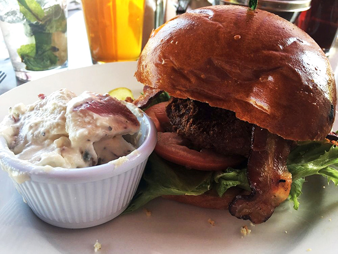 A burger that requires both hands and a strategy—the potato salad alongside might be the supporting actor, but it's gunning for that Academy Award.