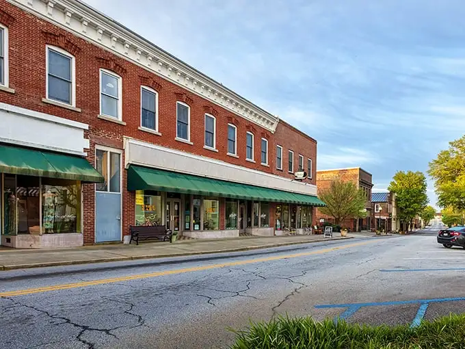 Classic storefronts with green awnings invite unhurried browsing—shopping as it was meant to be, before algorithms decided what we "might also like."