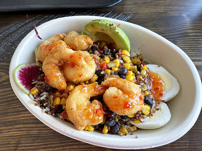 Not your average shrimp bowl! These plump beauties perch atop a colorful medley of grains and veggies, with avocado adding buttery richness.