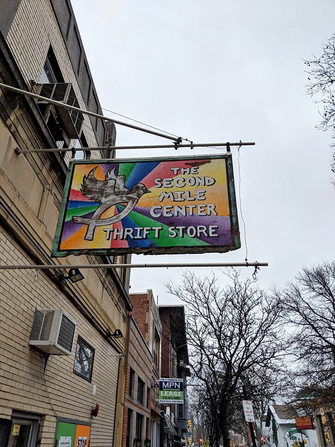 The rainbow-hued hanging sign announces this thrifting paradise to passersby, a colorful beacon for the budget-conscious and vintage-loving alike.