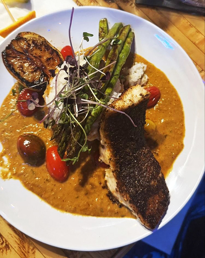 Fish this perfectly seared should have its own Instagram account. The sauce isn't just talking—it's singing a full tropical symphony.