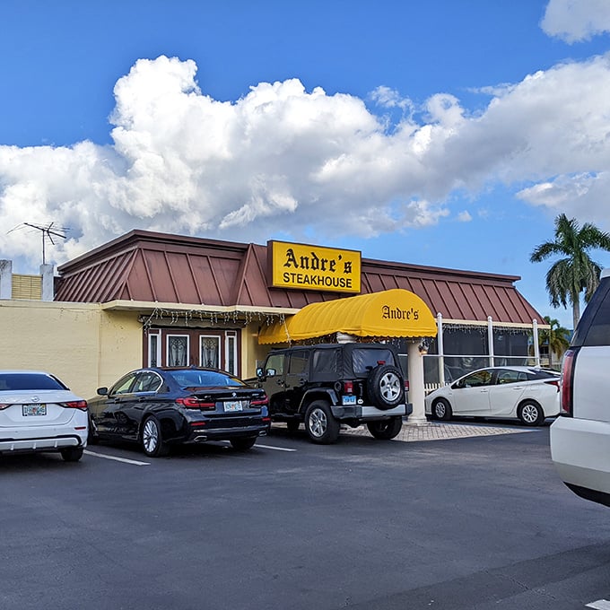Andre's bright yellow awning signals joy ahead - like a culinary sunshine greeting Naples diners for decades.