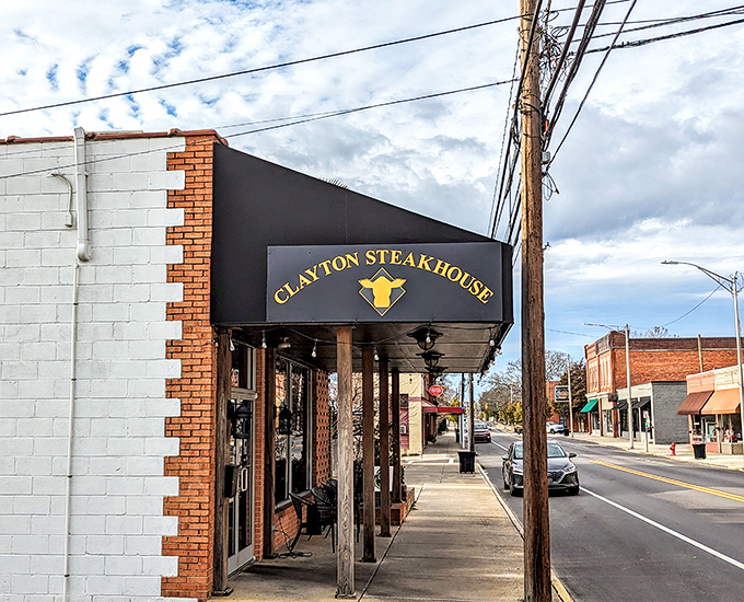 Clayton Steakhouse's downtown storefront transforms into a magical dining destination at night, like Cinderella after her fairy godmother worked some bibbidi-bobbidi-beef.
