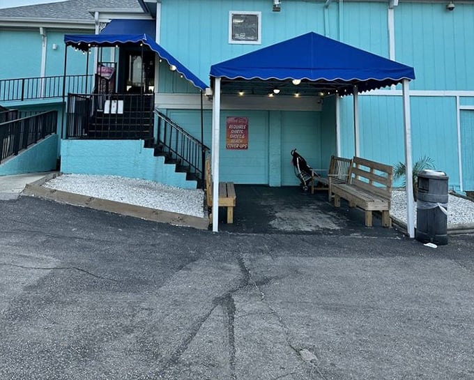 Crabby Bill's blue exterior might look cool, but inside is where the real heat happens – sizzling fresh grouper.
