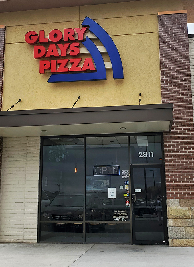 Glory Days' bold sign promises pizza satisfaction. No need for fancy words when the pizza speaks for itself!