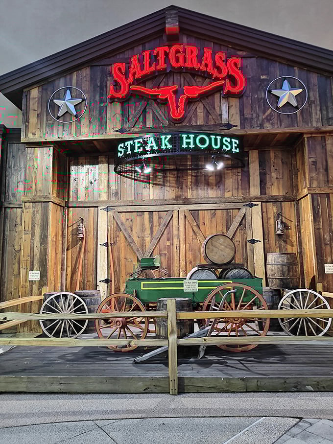 Saltgrass Steak House (Nashville): Wagon wheels, wooden walls, and a glowing red sign – Texas swagger meets Nashville flavor.