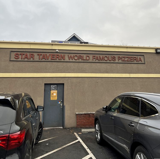 Star Tavern's no-nonsense exterior hides pizza greatness – where bar pies achieve their highest form behind that unassuming door.