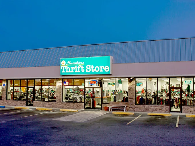 Sunshine Thrift's turquoise sign glows against the Florida sky – a promise of bargains as refreshing as ocean waves.