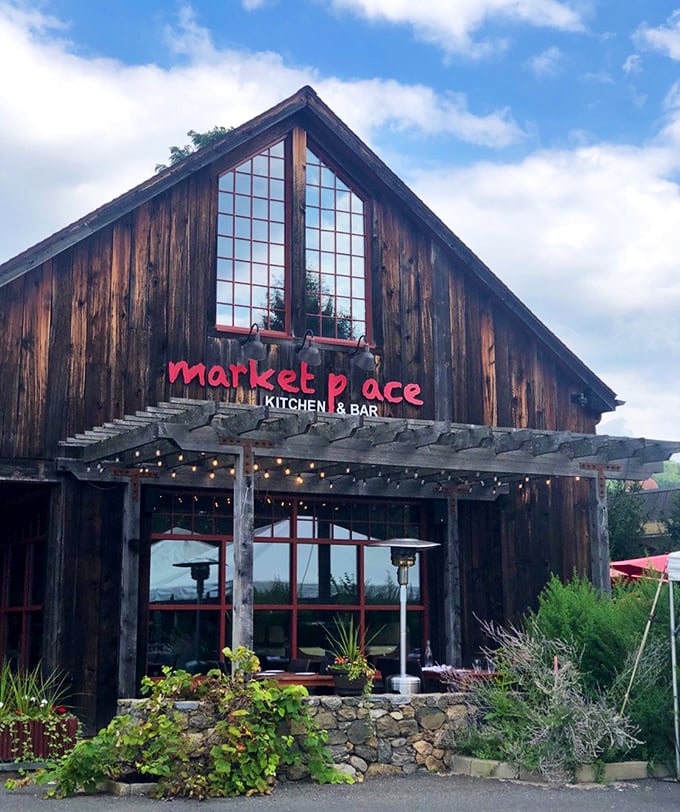 This rustic barn with its massive windows isn't just serving dinner – it's framing the perfect New England food fantasy.