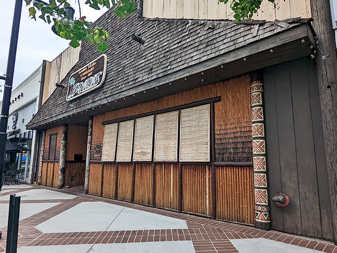 The bamboo exterior hints at the Polynesian paradise within – where Mai Tais and ribeyes have been best friends for decades.