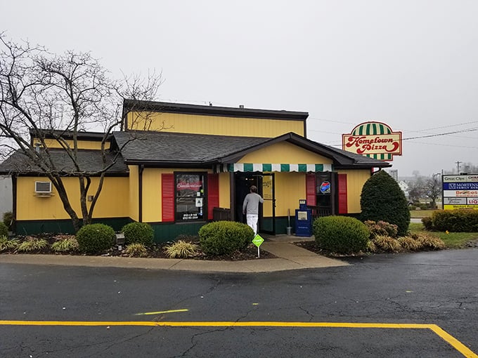 The cheerful exterior matches the mood inside, where pizza traditions are kept alive one pie at a time.