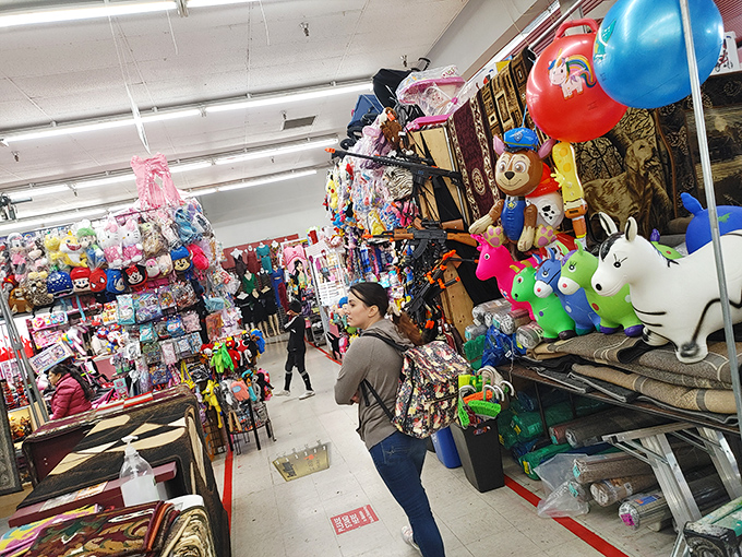 Stuffed animals and toys create a colorful jungle of childhood joy. Even adults can't help but feel like kids in this whimsical wonderland.