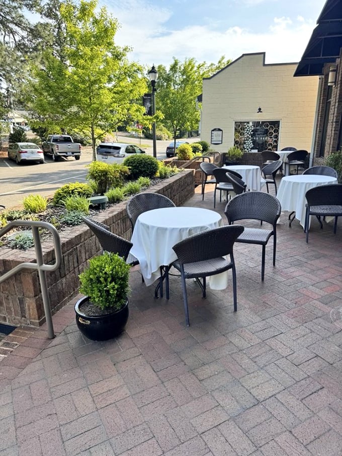 White tablecloths await on this charming patio—because great steaks deserve great surroundings and fresh air.