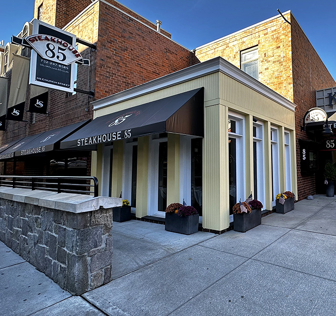Classic architecture meets modern dining at Steakhouse 85. That awning isn't just navy blue – it's a promise of excellence.