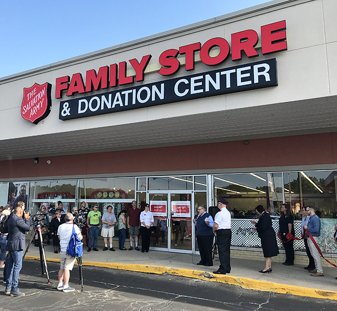 A gathering outside the Salvation Army store—perhaps a grand opening or special event where thrift meets community spirit.