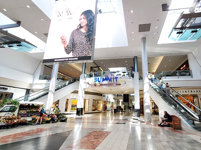 Two-story shopping paradise with escalators leading upward - because sometimes retail heaven requires a little climbing.