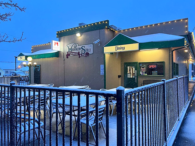 Winter transforms Washington Street Steakhouse into a cozy haven where the warmth inside matches the glow of lights outside.