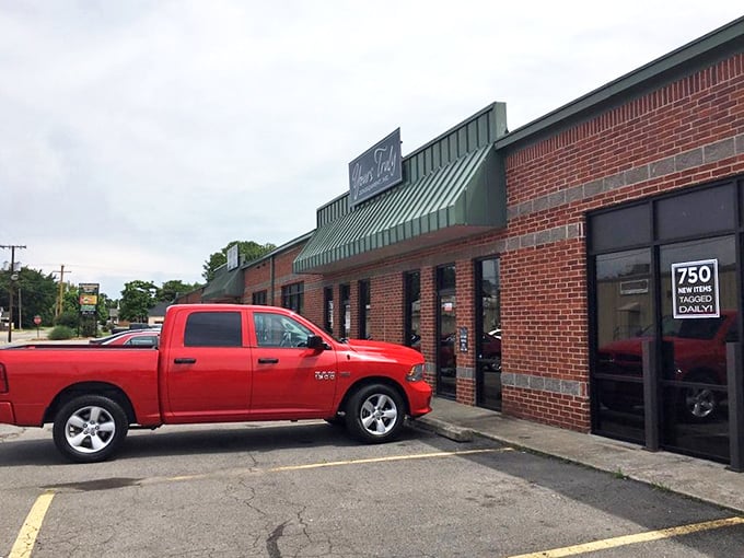 The red truck seems to know what we all do—Yours Truly is worth stopping for, even on a busy day!