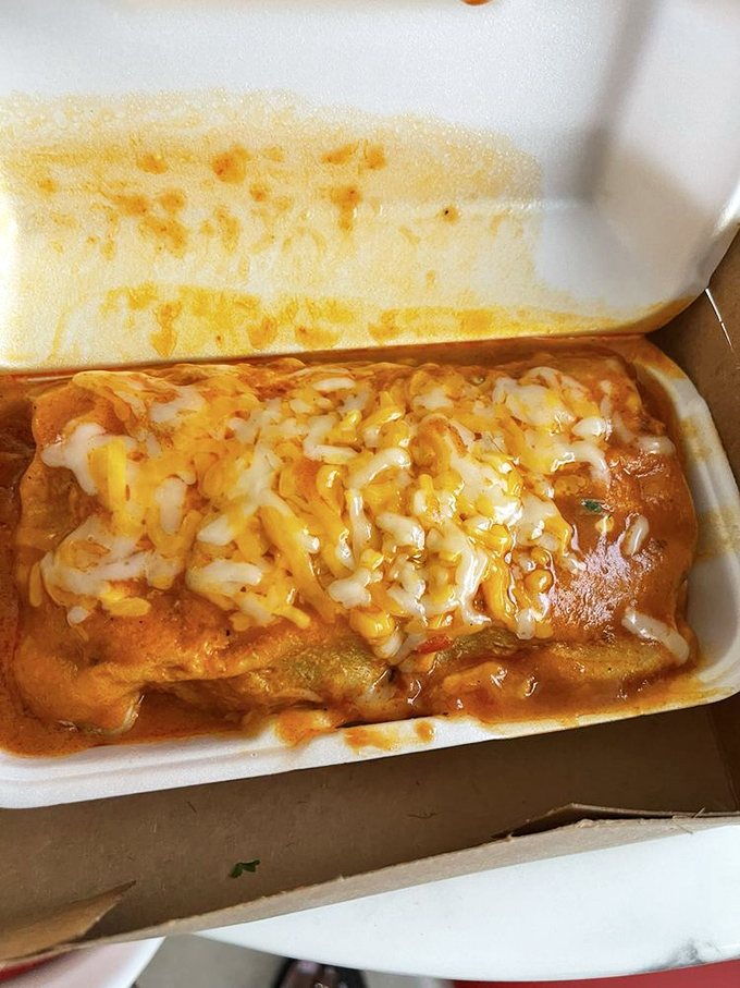 Not all heroes wear capes—some come wrapped in tortillas. This asado burrito, blanketed in melted cheese, is comfort food defined.