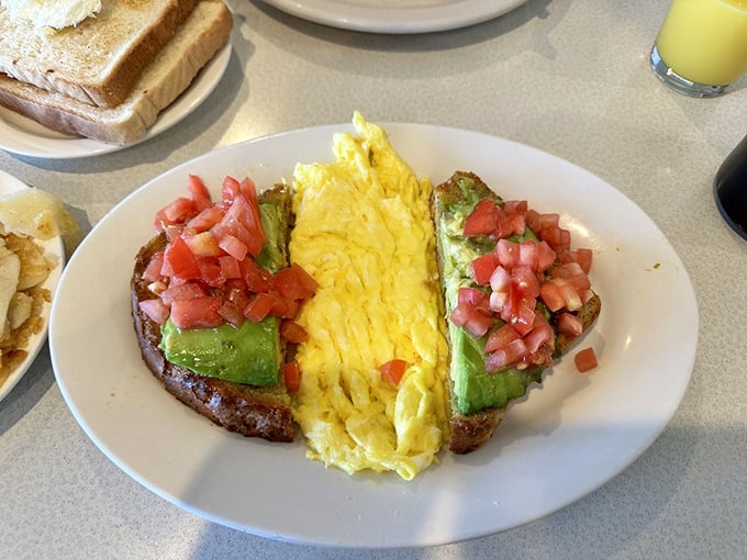The California-Philly alliance at its finest—creamy avocado and farm-fresh eggs create a breakfast masterpiece that's both virtuous and indulgent.