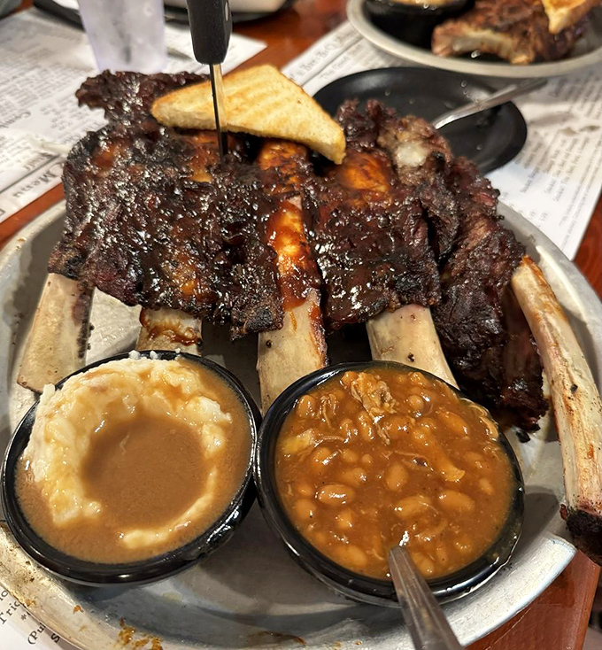 Beef ribs that Fred Flintstone would approve of – prehistoric in size, modern in flavor, with sides that know their supporting role.