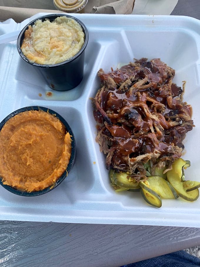 Sweet potato side, mac and cheese, and saucy pulled pork – the holy trinity of Southern comfort on a single tray.