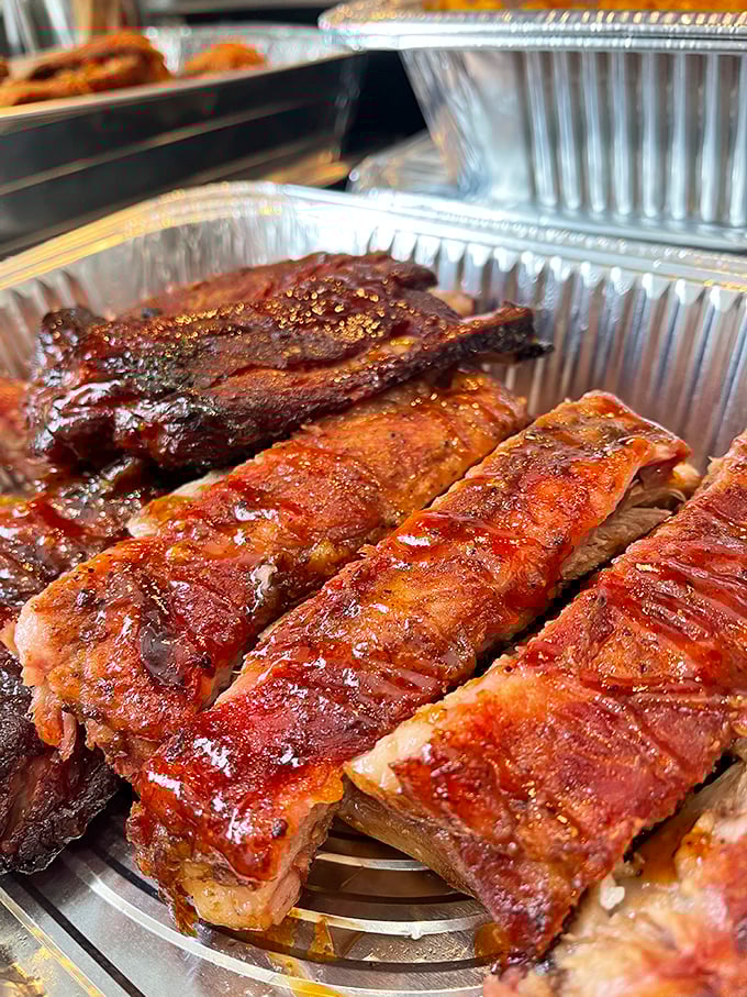 These ribs aren't just falling off the bone—they're practically jumping into your mouth with a smoky-sweet glaze that should be illegal in 49 states.
