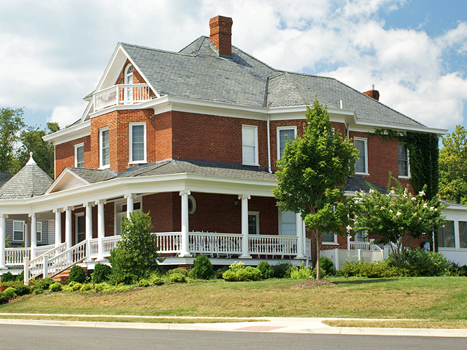 Victorian architecture meets Southern hospitality in this classic brick home. The wraparound porch practically begs for rocking chairs and glasses of sweet tea.